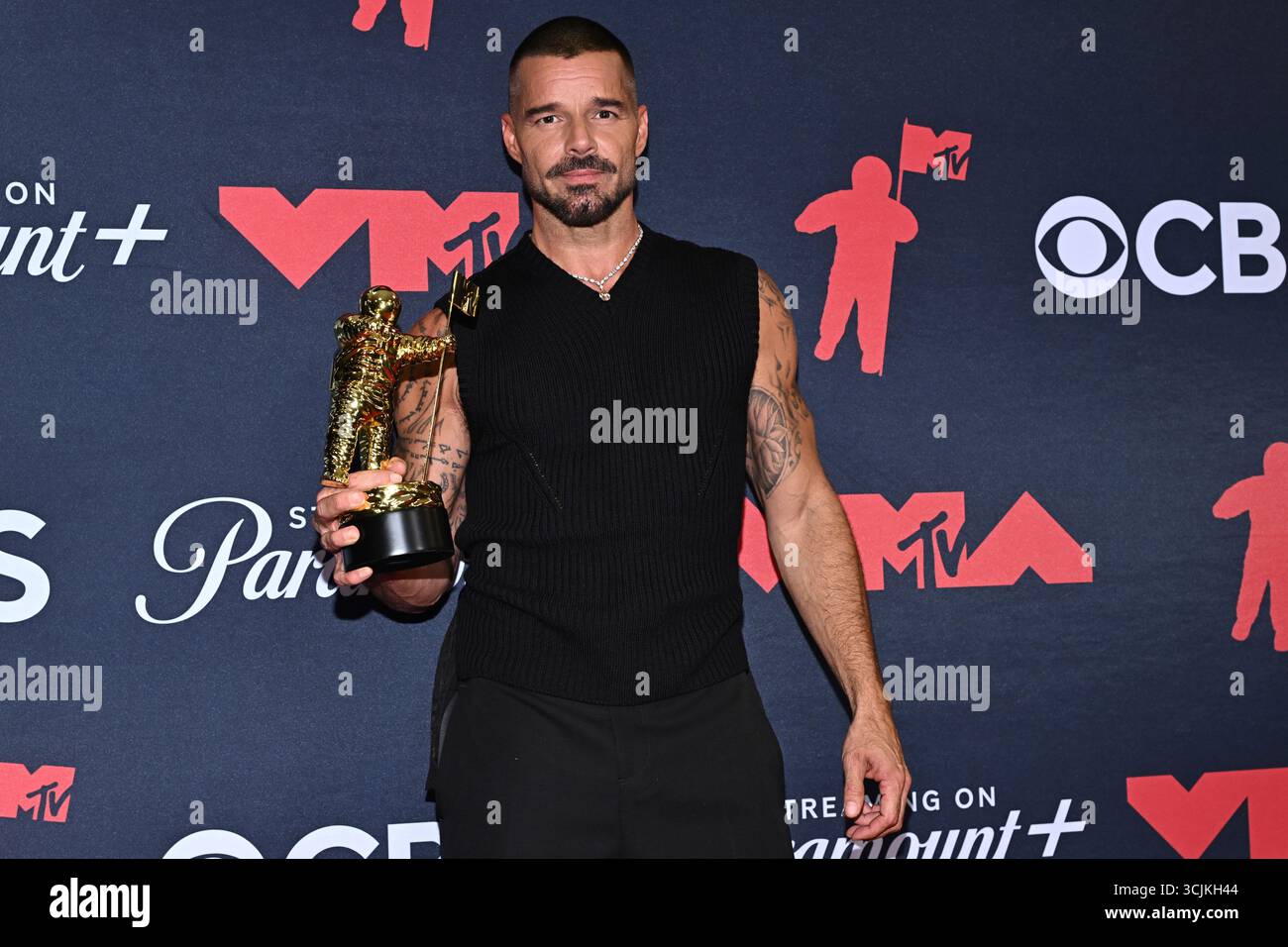Ricky Martin, winner of the latin icon award, poses in the press room ...