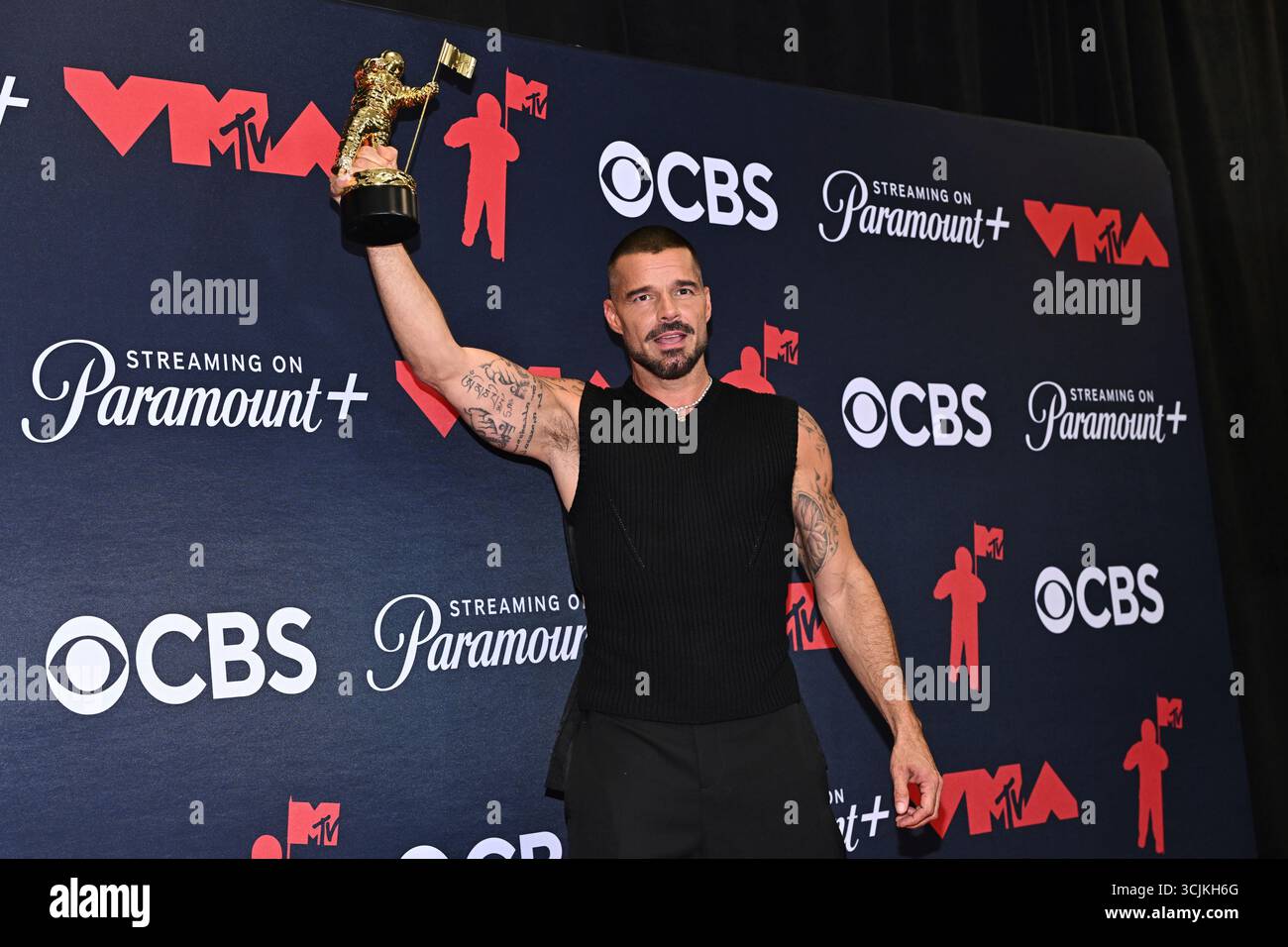 Ricky Martin, winner of the latin icon award, poses in the press room ...