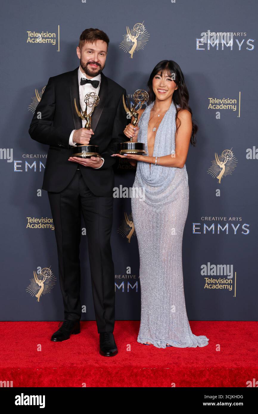 Maciej Kuciara, left, and Emily Yang with their Emmy for Outstanding ...