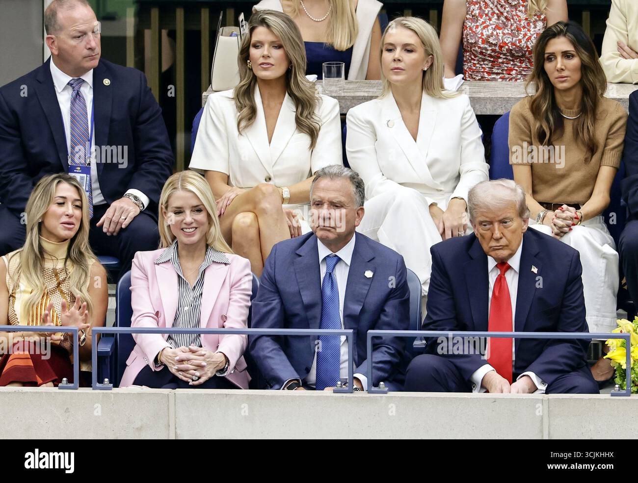 U.S. President Donald Trump (front row, far R) watches the U.S. Open ...