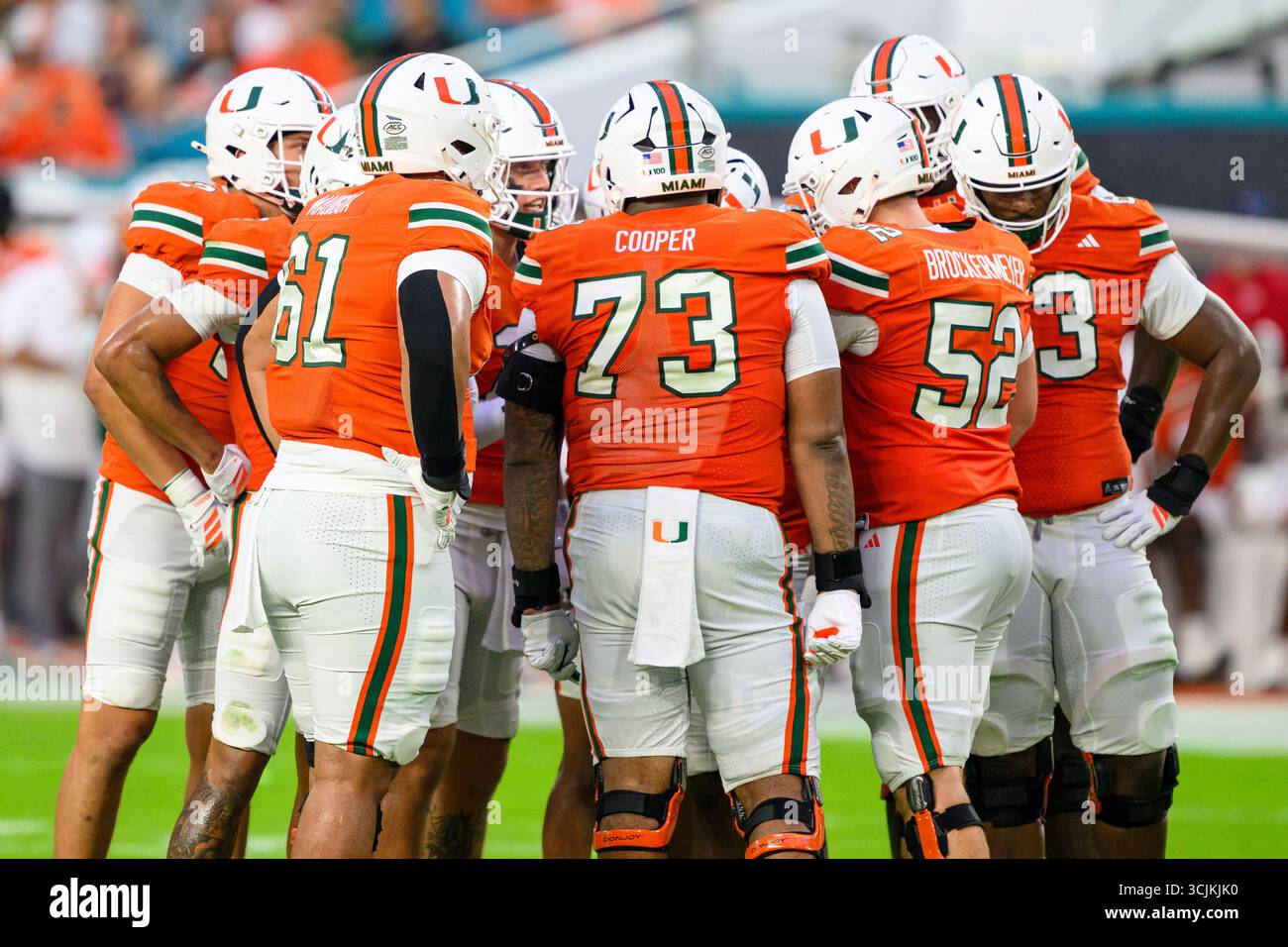 MIAMI GARDENS, FL - SEPTEMBER 06: Miami Hurricanes quarterback Carson Beck (center) calls a play ...