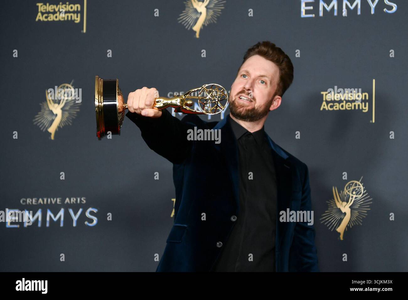 Jordan Klepper poses in the press room with the award for outstanding ...