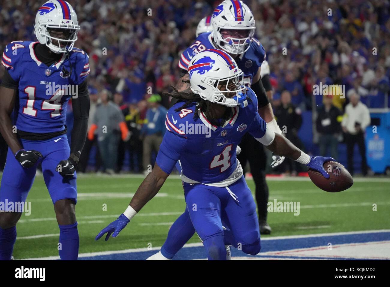 Buffalo Bills running back James Cook (4) scores a touchdown against ...