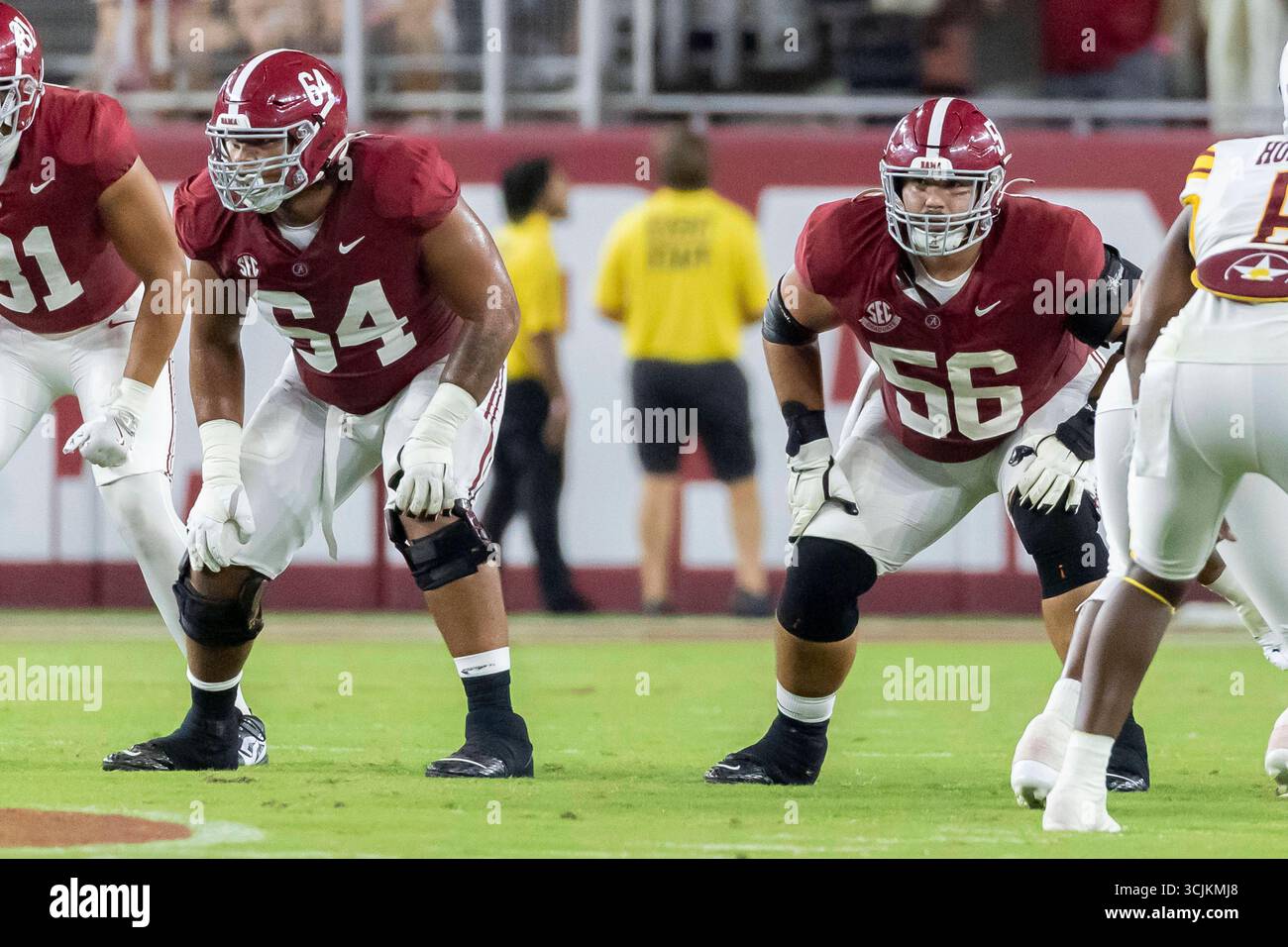 Alabama offensive linemen Michael Carroll (64) and Geno VanDeMark (56) set up at the line during ...