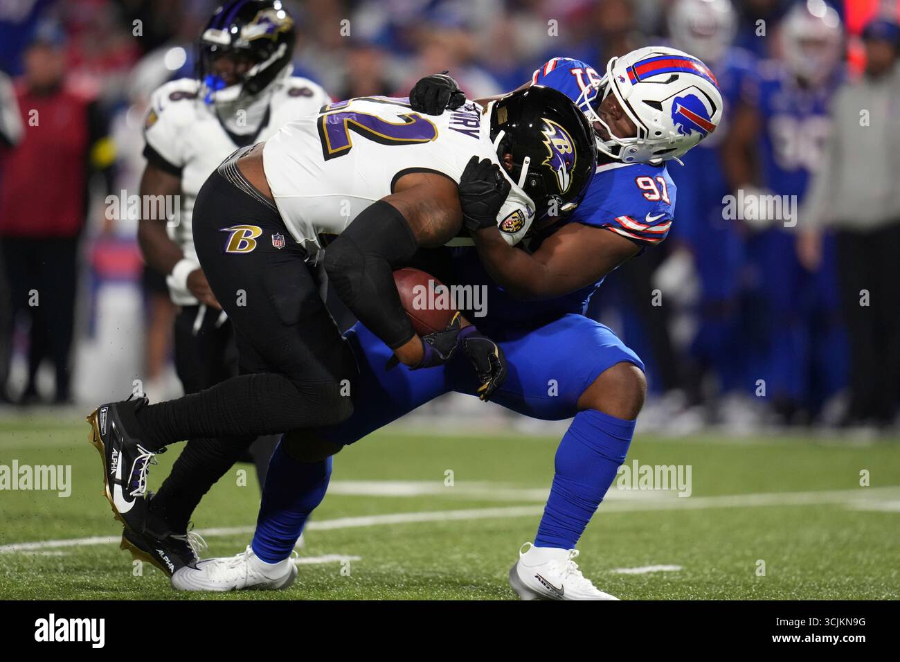 Baltimore Ravens running back Derrick Henry (22) is stopped by Buffalo ...