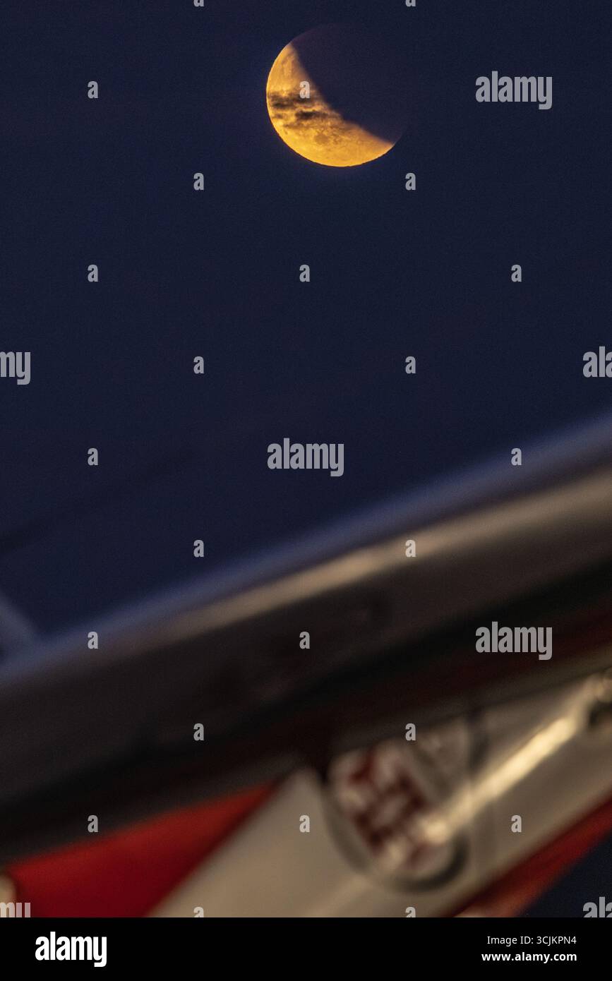 A red full moon, also known as a blood moon, is seen during a lunar ...