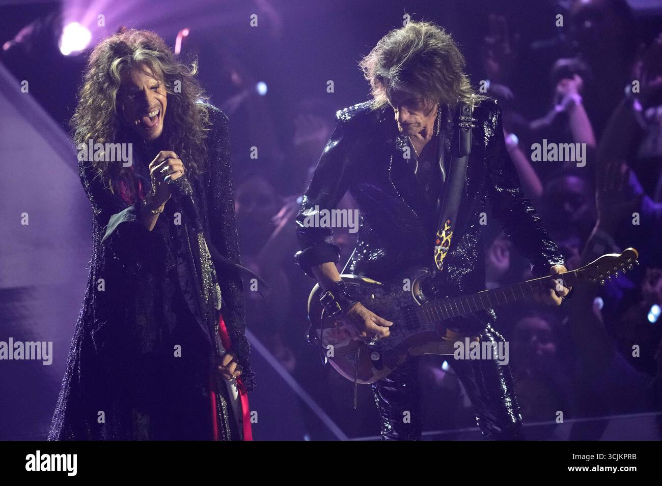 Steven Tyler, left, and Joe Perry perform a tribute to Ozzy Osbourne ...
