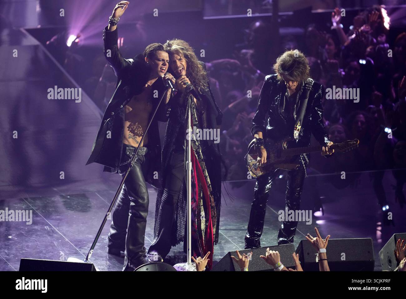 Yungblud, from left, Steven Tyler, and Joe Perry perform a tribute to Ozzy Osbourne during the ...