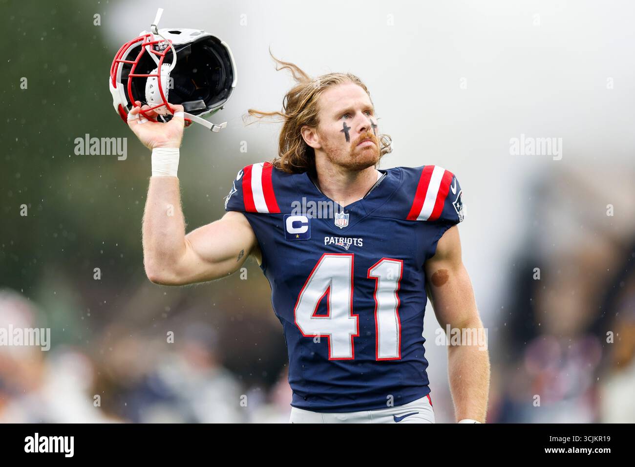 New England Patriots safety Brenden Schooler (41) removes his helmet ...