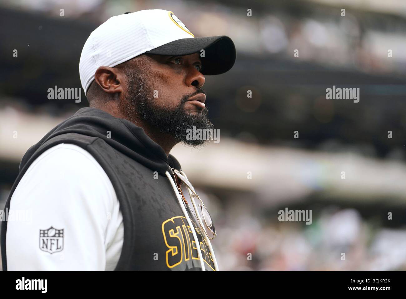 Pittsburgh Steelers head coach Mike Tomlin walks on the field before an ...