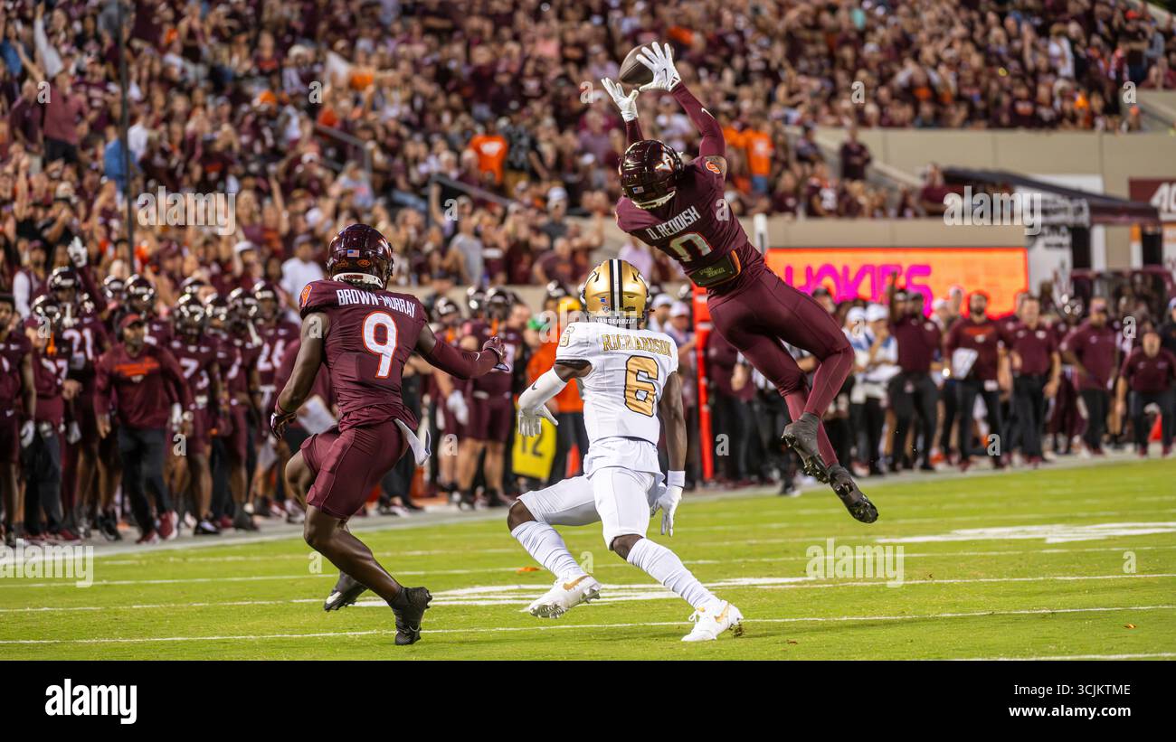 Virginia Tech safety Quentin Reddish (0) intercepts the pass in front ...