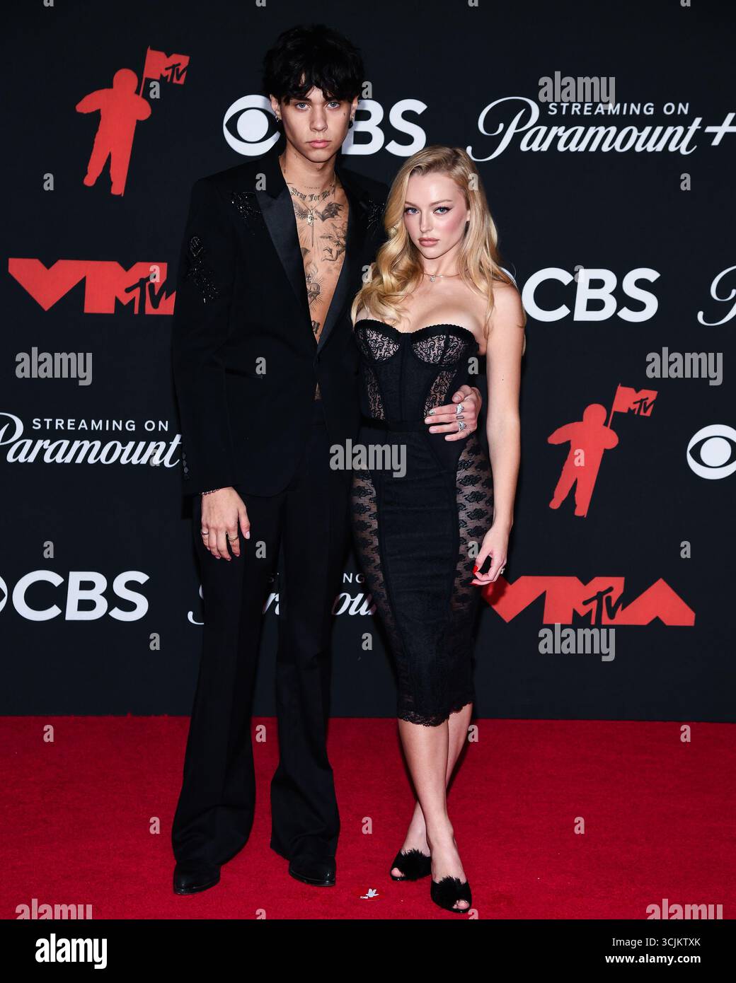 Landon Barker and Skyla Sanders walking on the red carpet at the 2025 ...