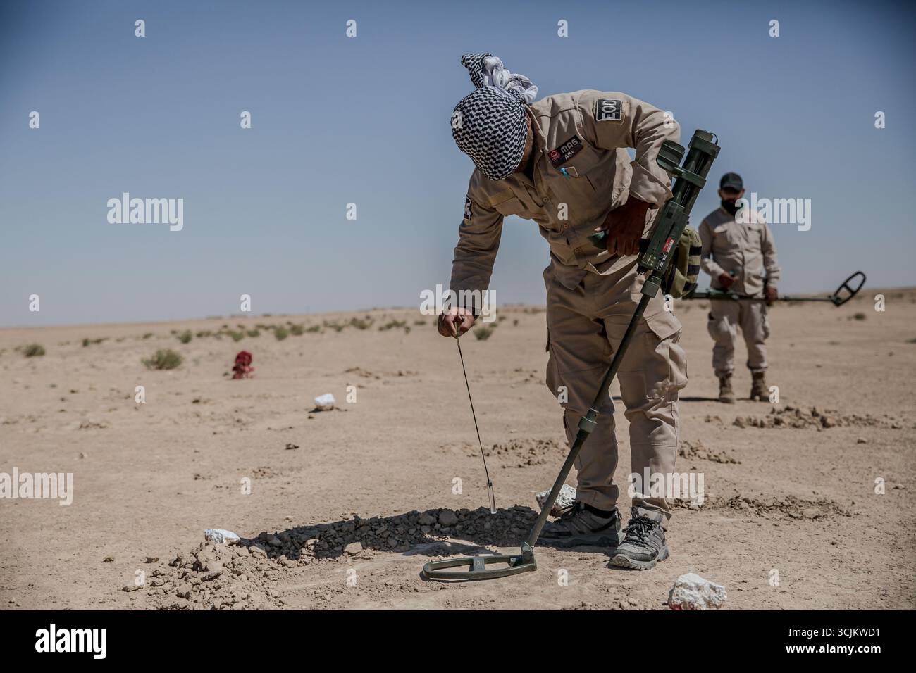 A deminer with the Mines Advisory Group (MAG) tests his equipment ahead ...
