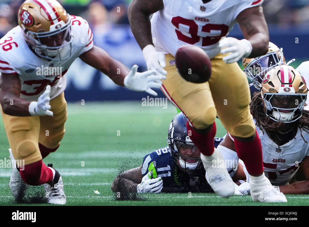 Seattle Seahawks wide receiver Jaxon Smith-Njigba (11) looks on after fumbling the ball, which ...