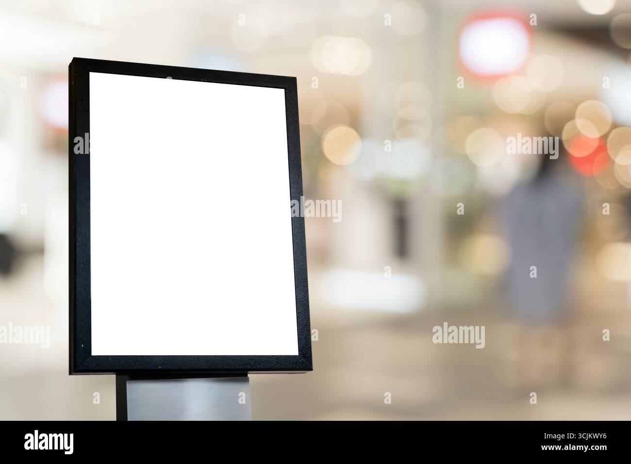 Blank signage mockup with black frame isolated on blurred shopping mall ...