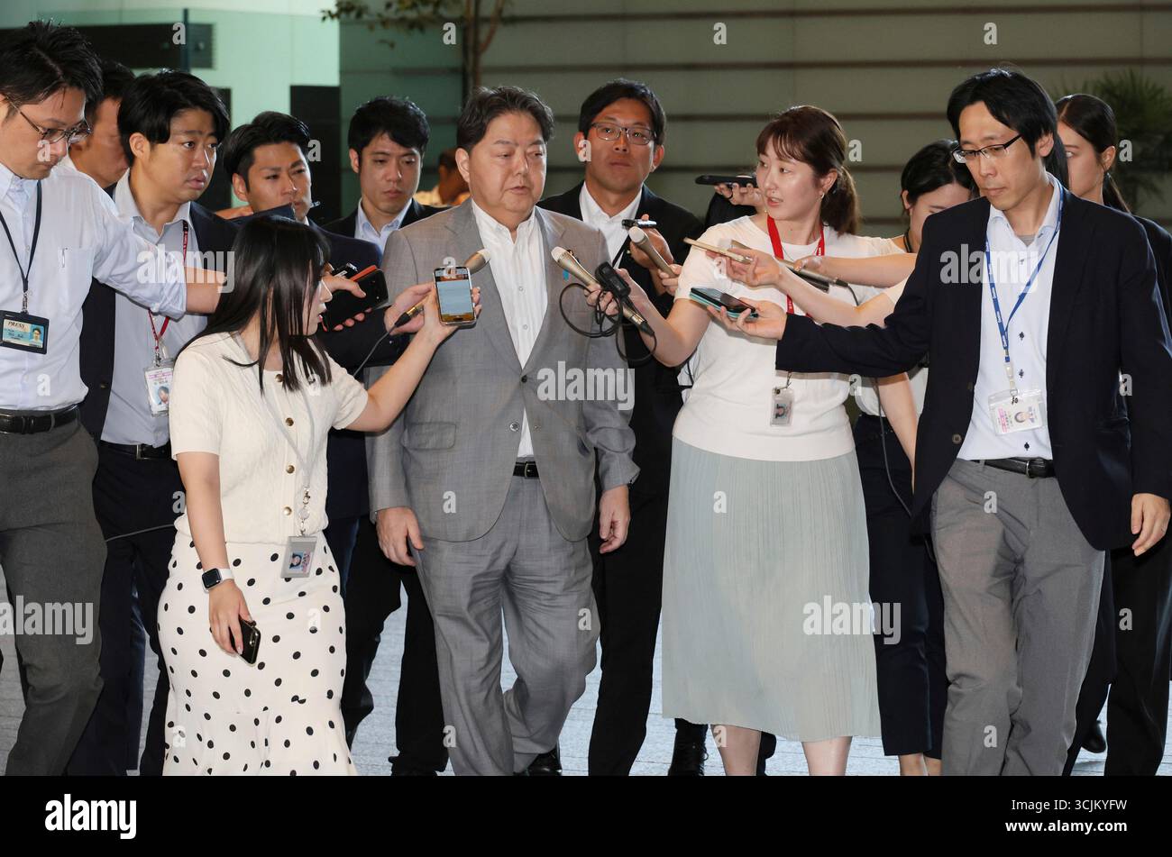 Japanese Chief Cabinet Secretary Yoshimasa Hayashi (C) arrives at the ...