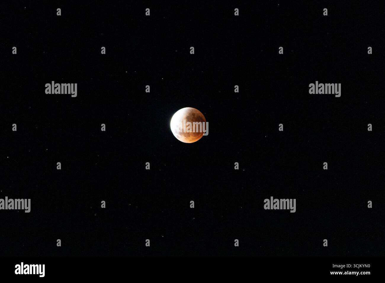 A total lunar eclipse is seen over Victoria, turning the Moon a deep ...