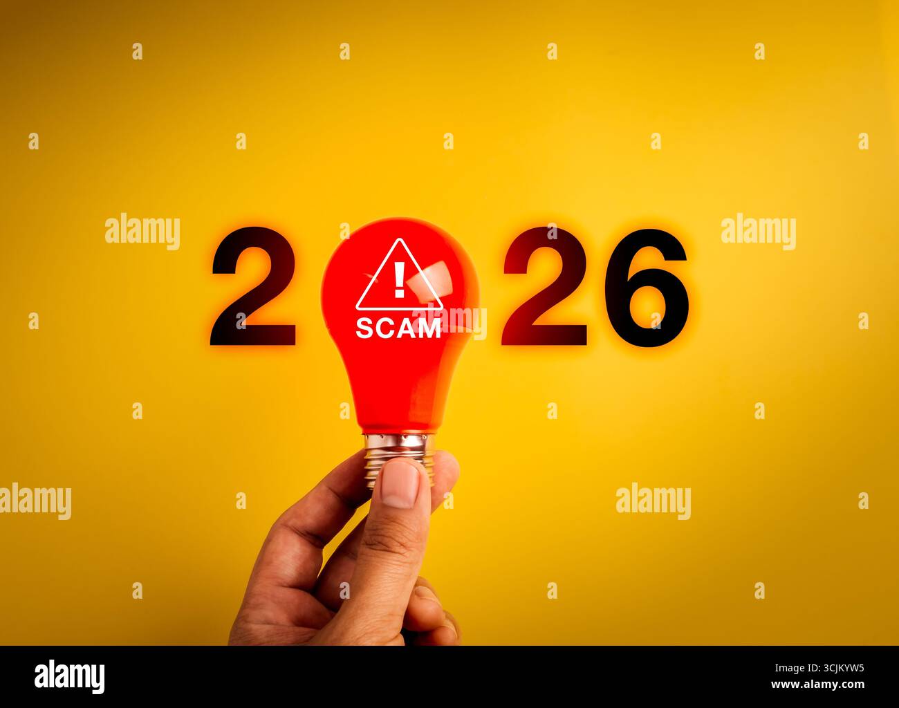 Scam alert 2026 concept with red warning light bulb and year numbers on ...