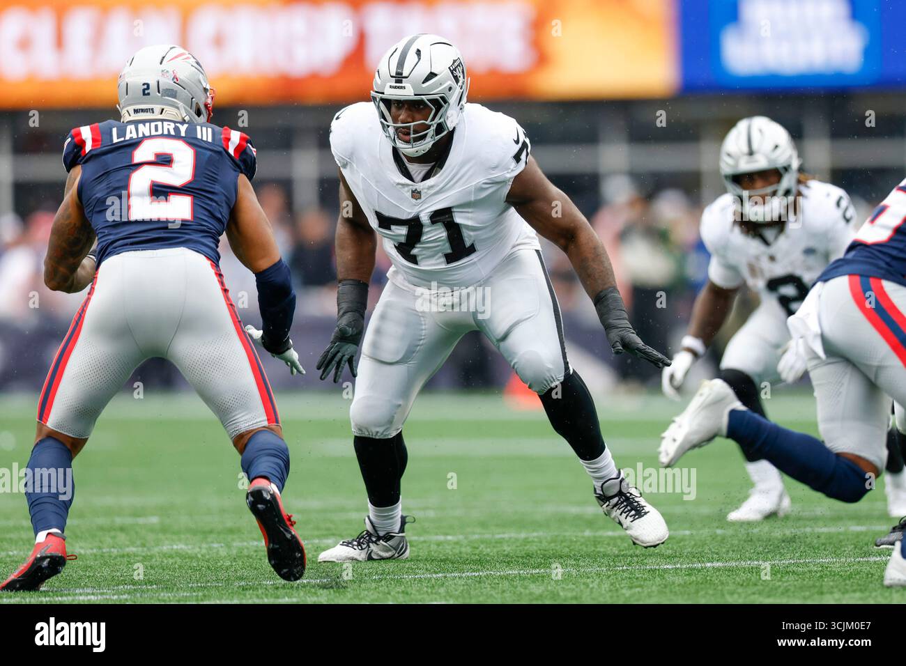 Las Vegas Raiders offensive tackle DJ Glaze (71) blocks New England ...
