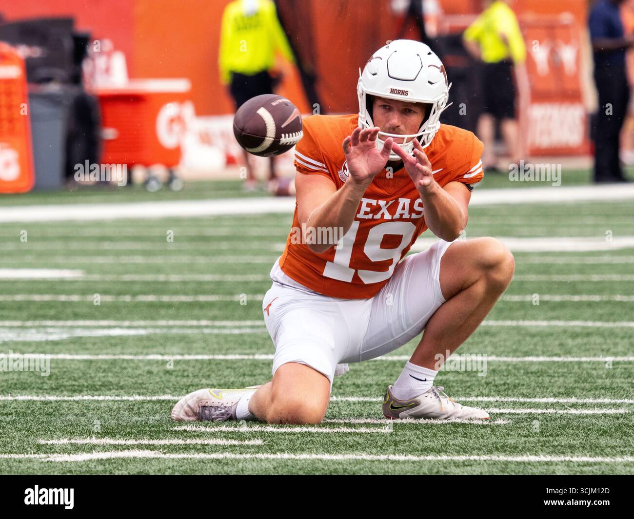 Texas punterJack Bouwmeester practices holding for fields goals before ...