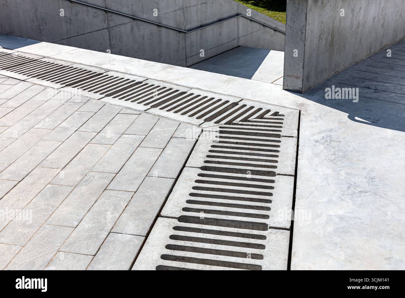 sewer grate for drainage system on concrete stairway. urban ...