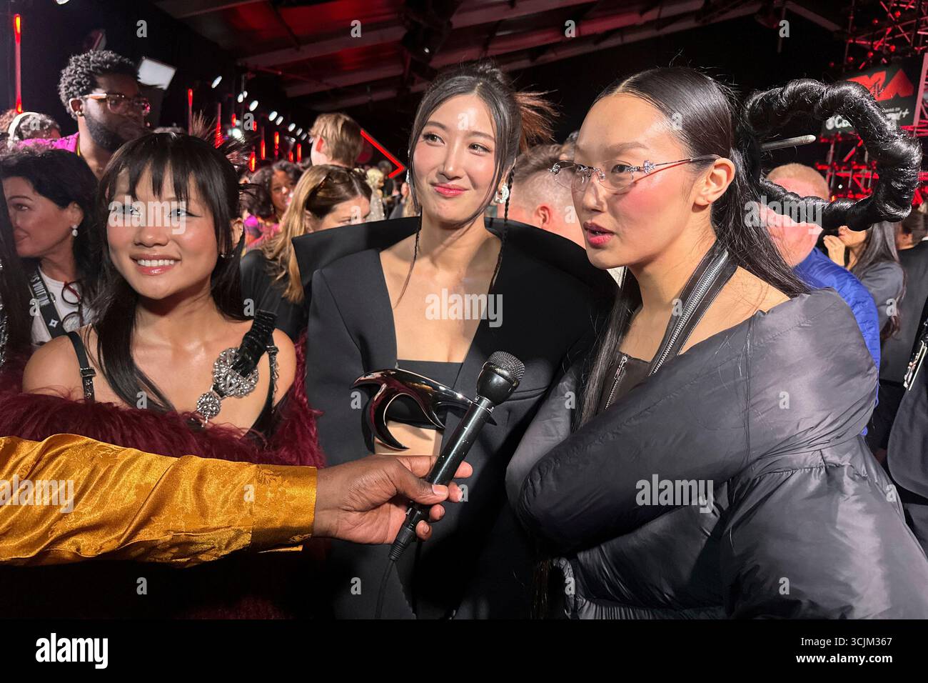 From left, Rei Ami, EJAE and Audrey Nuna, the voices behind the singing ...