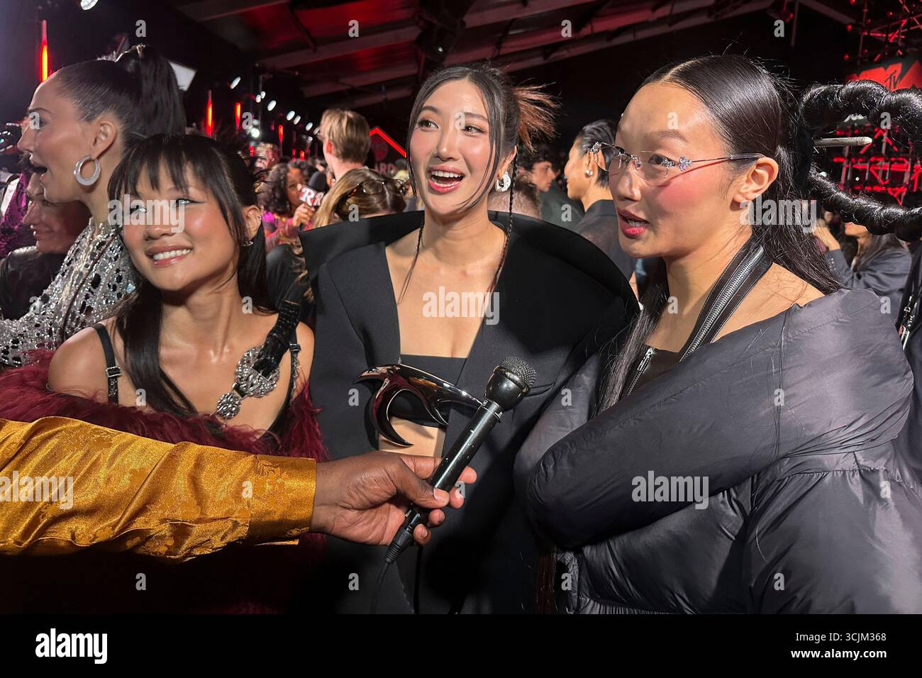 From left, Rei Ami, EJAE and Audrey Nuna, the voices behind the singing ...