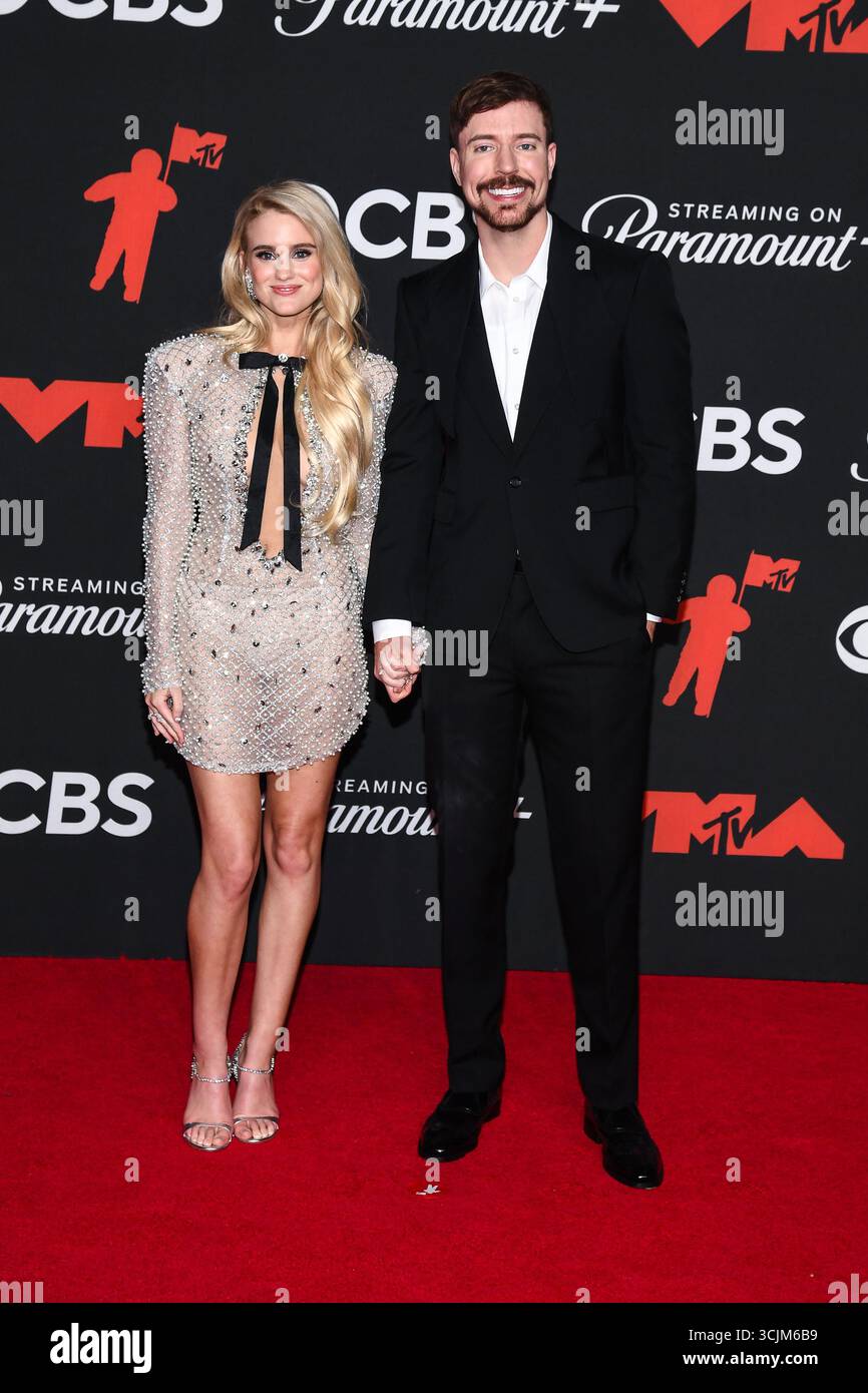 Thea Booysen and MrBeast walking on the red carpet at the 2025 MTV ...