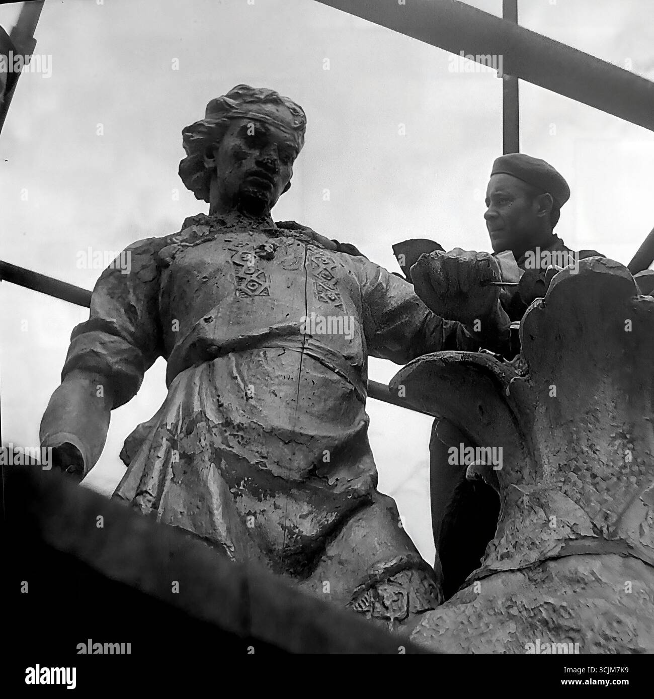 The process of installing or restoring the 'The Stone Flower' monument ...
