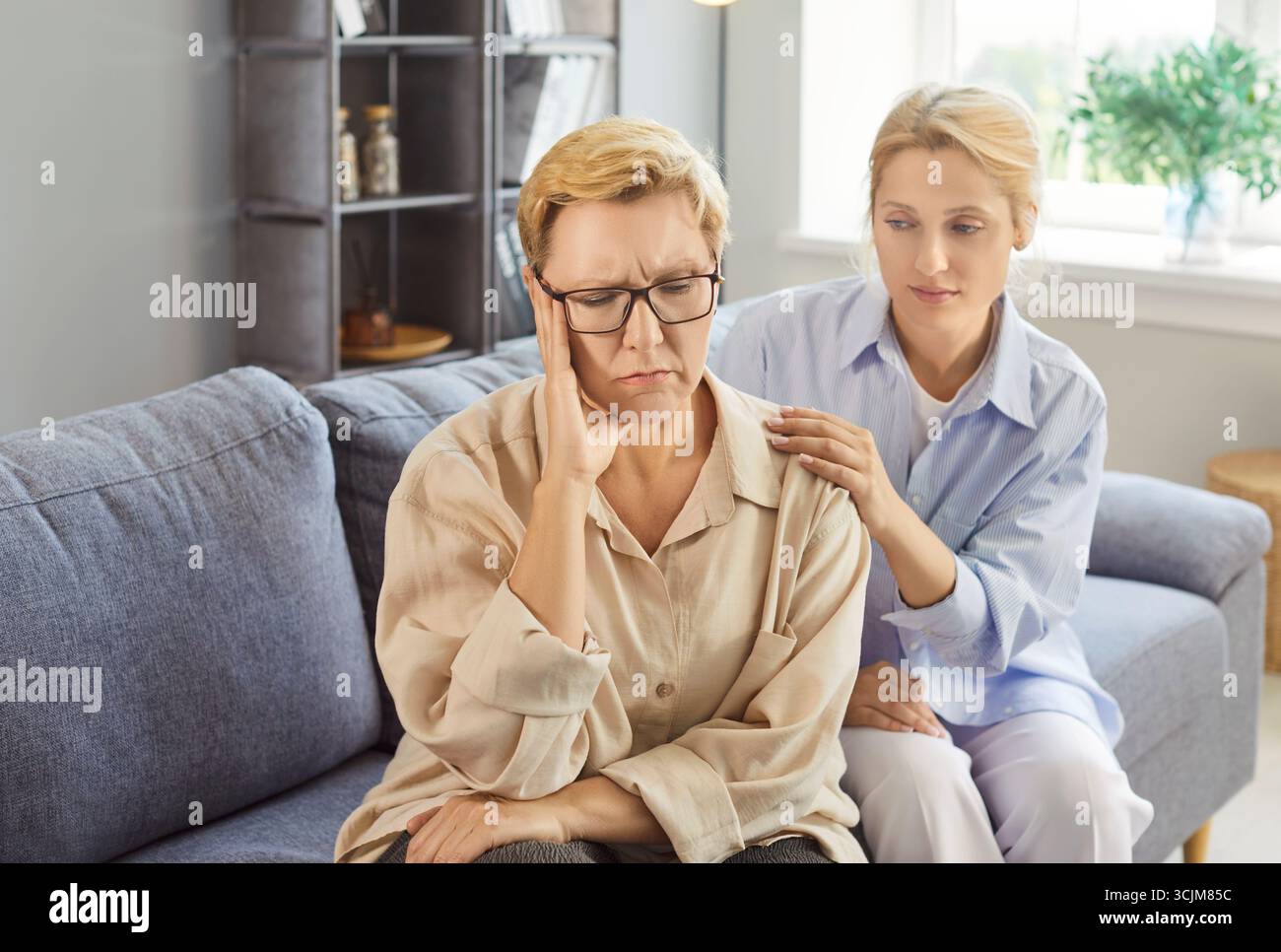 Woman supporting other in difficult situation, expressing empathy and ...