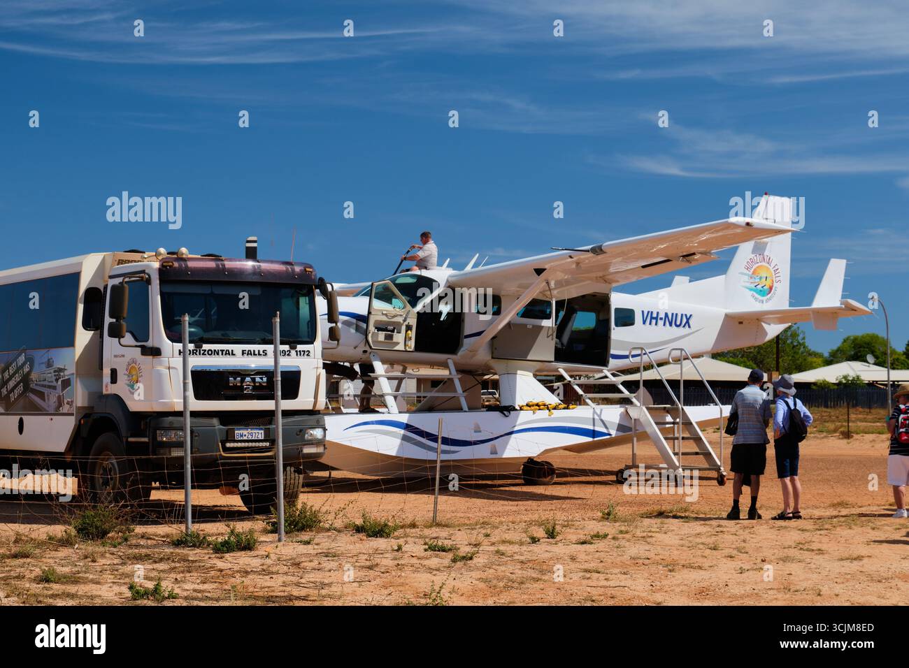 Tourists are waiting for boarding at the One Arm Point Airport ...