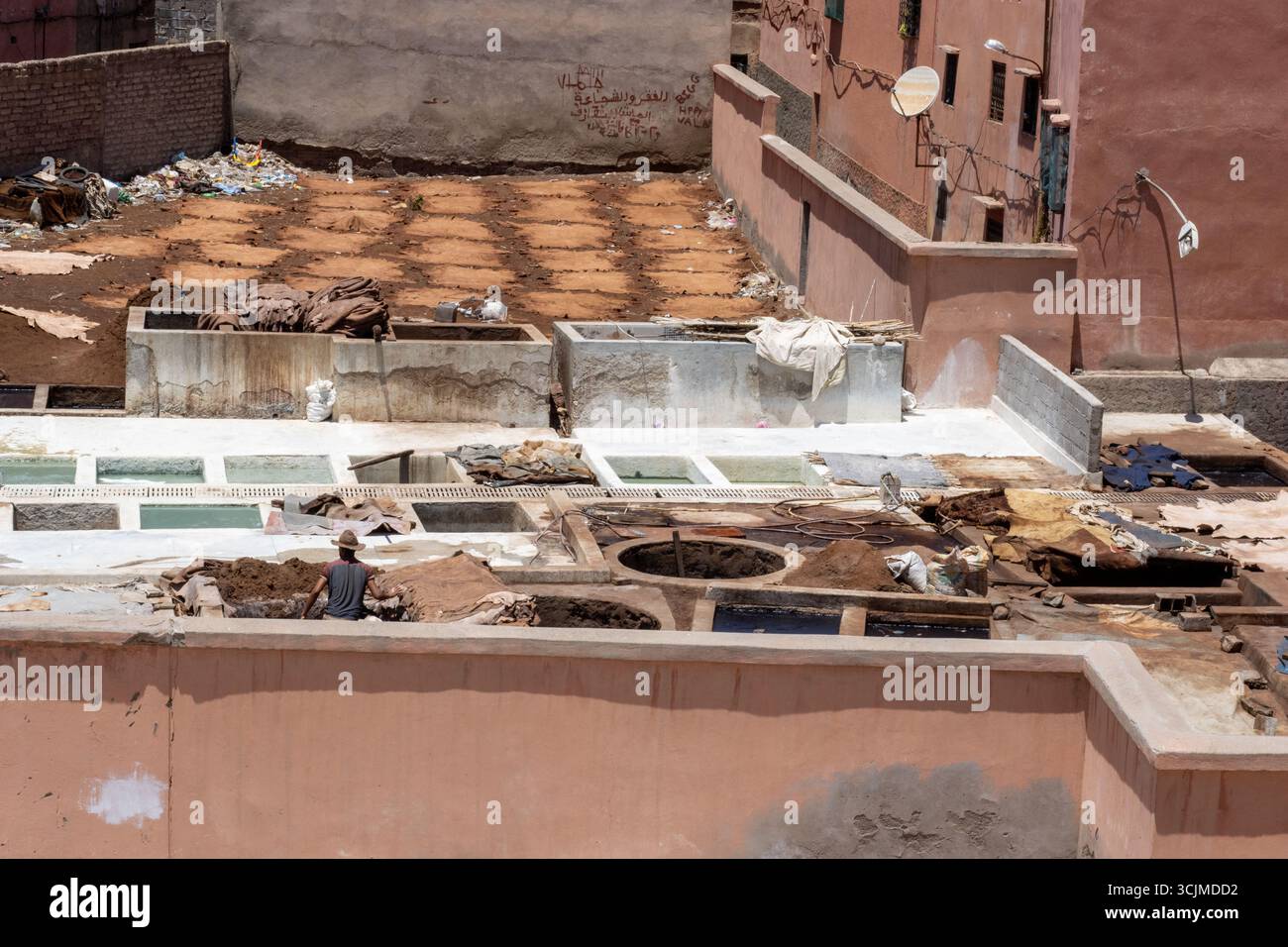 Walls of the city and typical leather tannerie in Marrakesh, Morocco ...