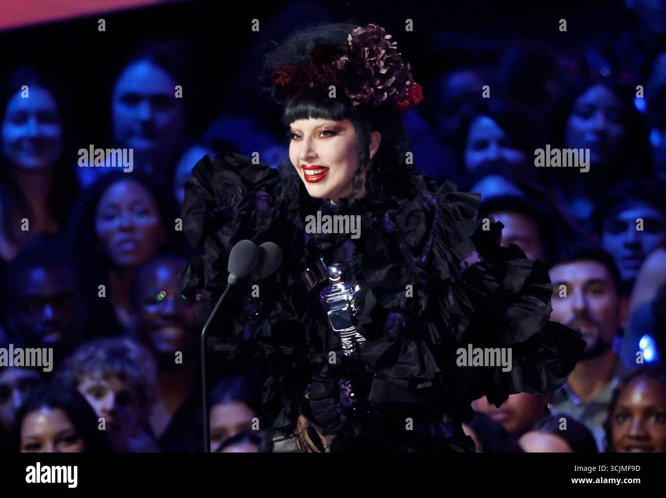 Lady Gaga accepts the "Artist of the Year" award at the 2025 MTV Video ...