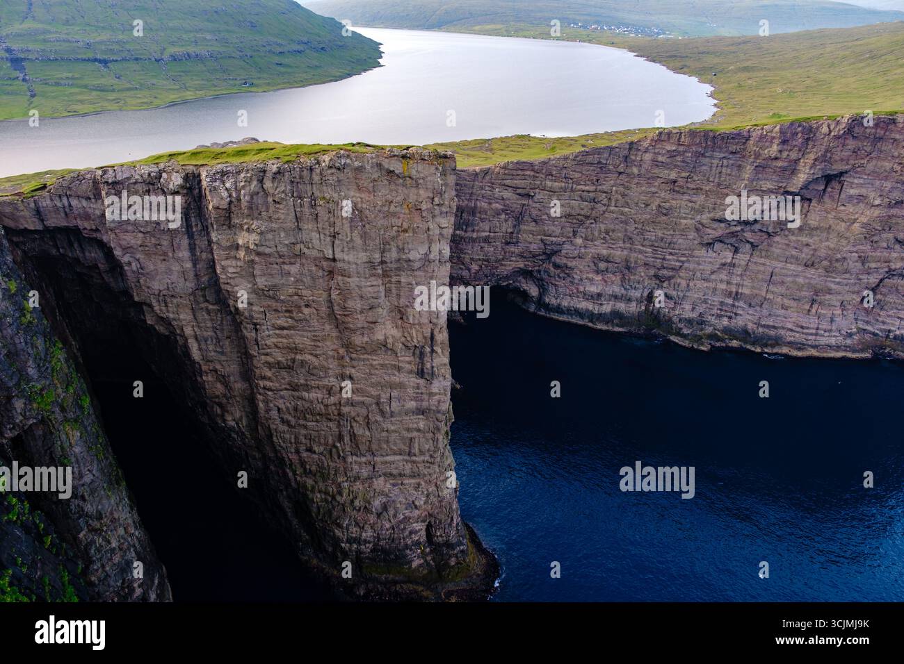 Breathtaking cliffs tower over calm hi-res stock photography and images ...