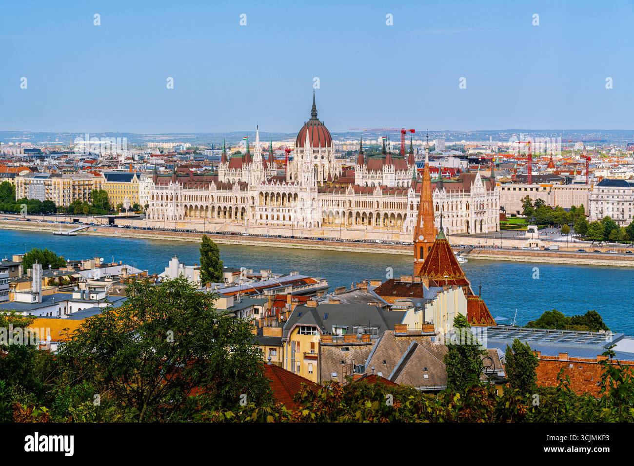 Budapest Parliament building on the Danube river with cityscape and ...