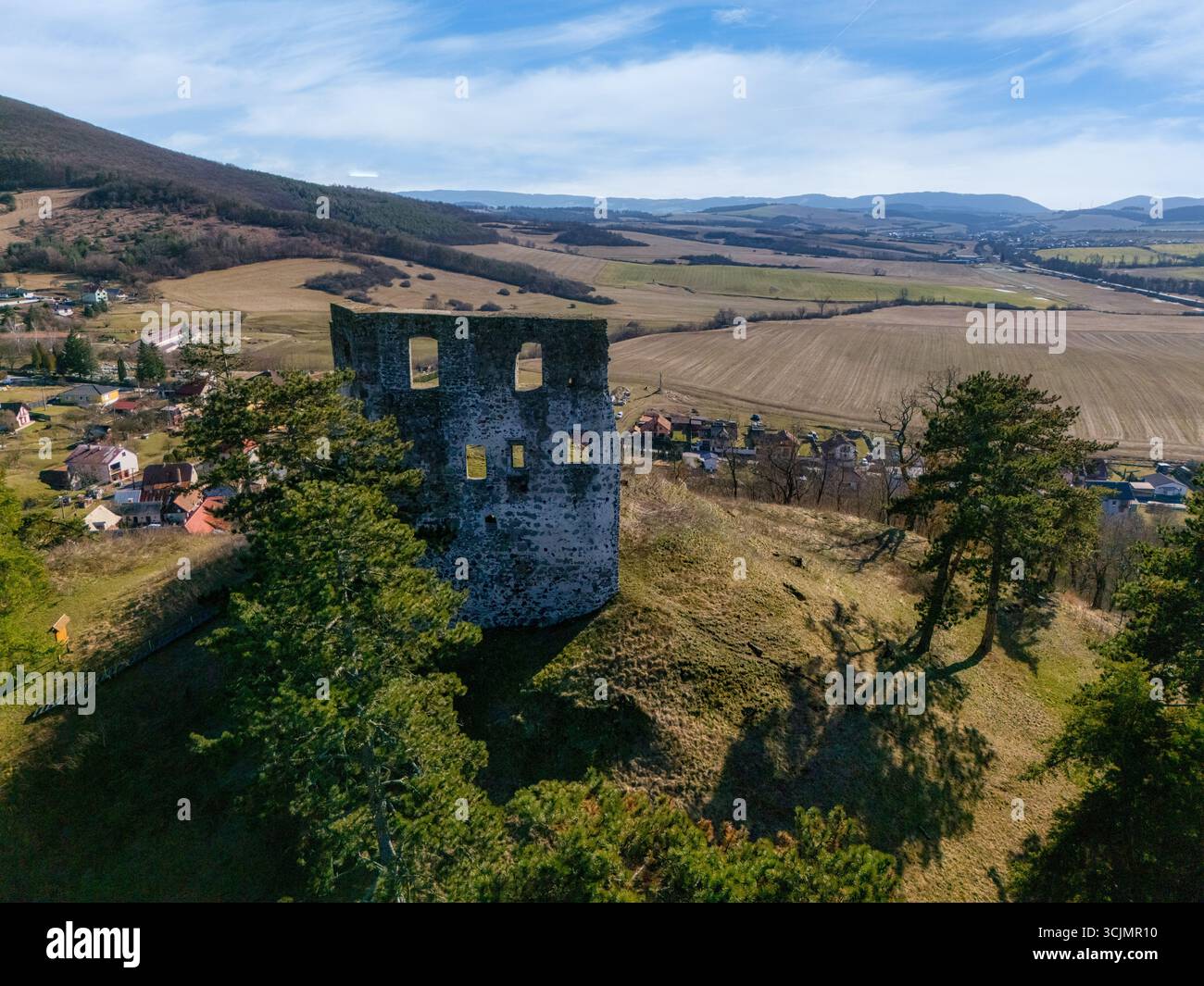 Aerial view of the stark stone ruins of the Vígľaš Castle tower stand ...