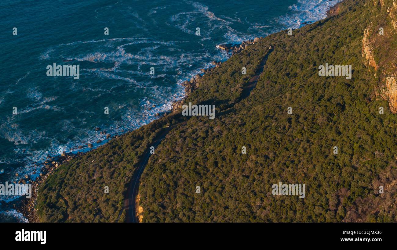 Aerial view of the rugged coastline where the dark blue ocean meets the ...