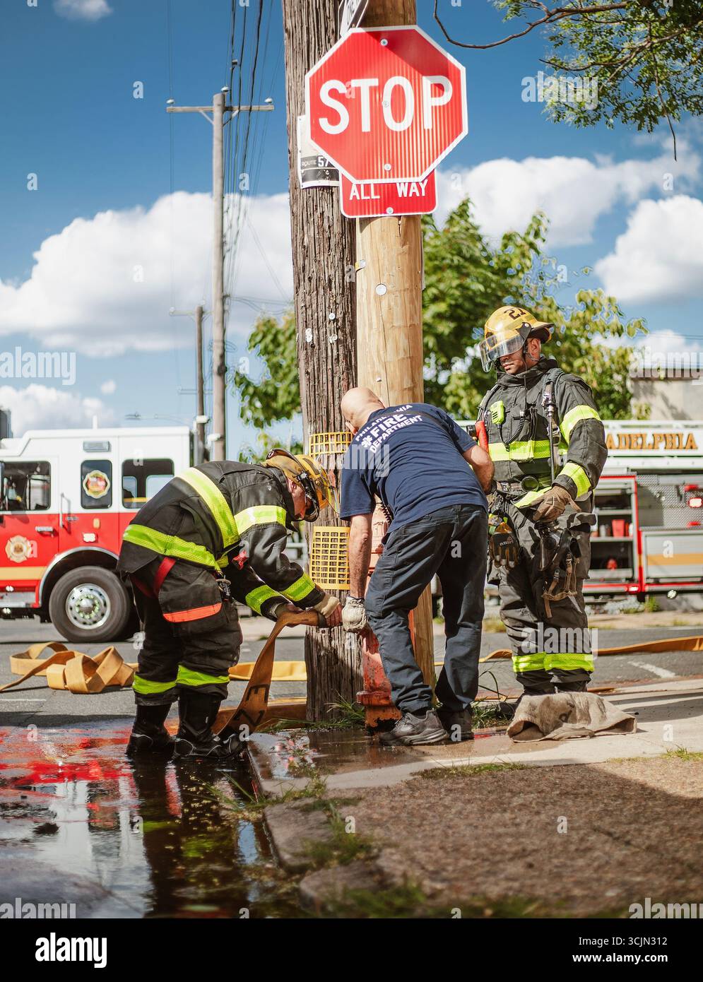 Firefighters fill a hydrant with water in Philadelphia Stock Photo - Alamy