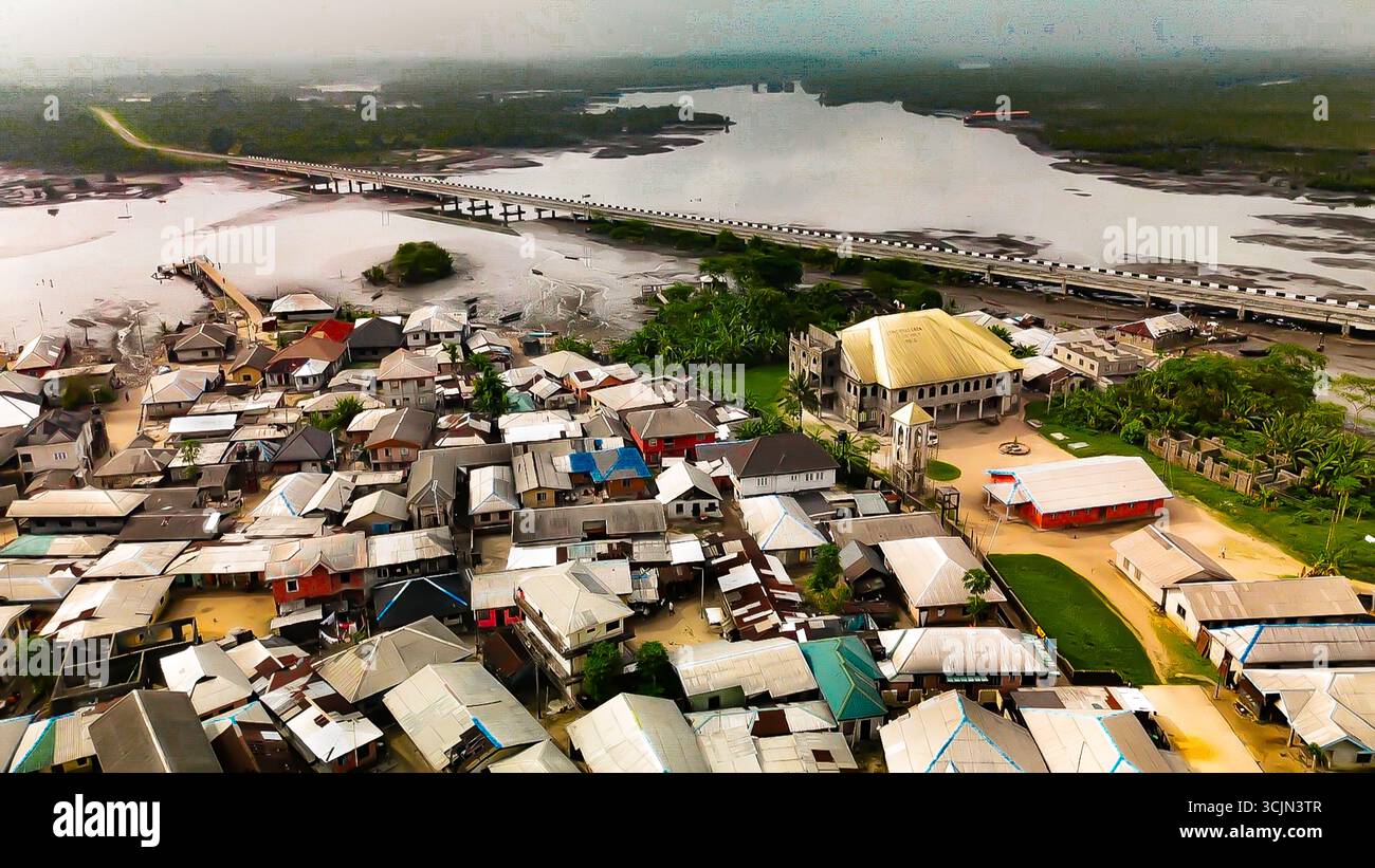 Aerial view of a bridge stretching over a river, contrasting with the ...