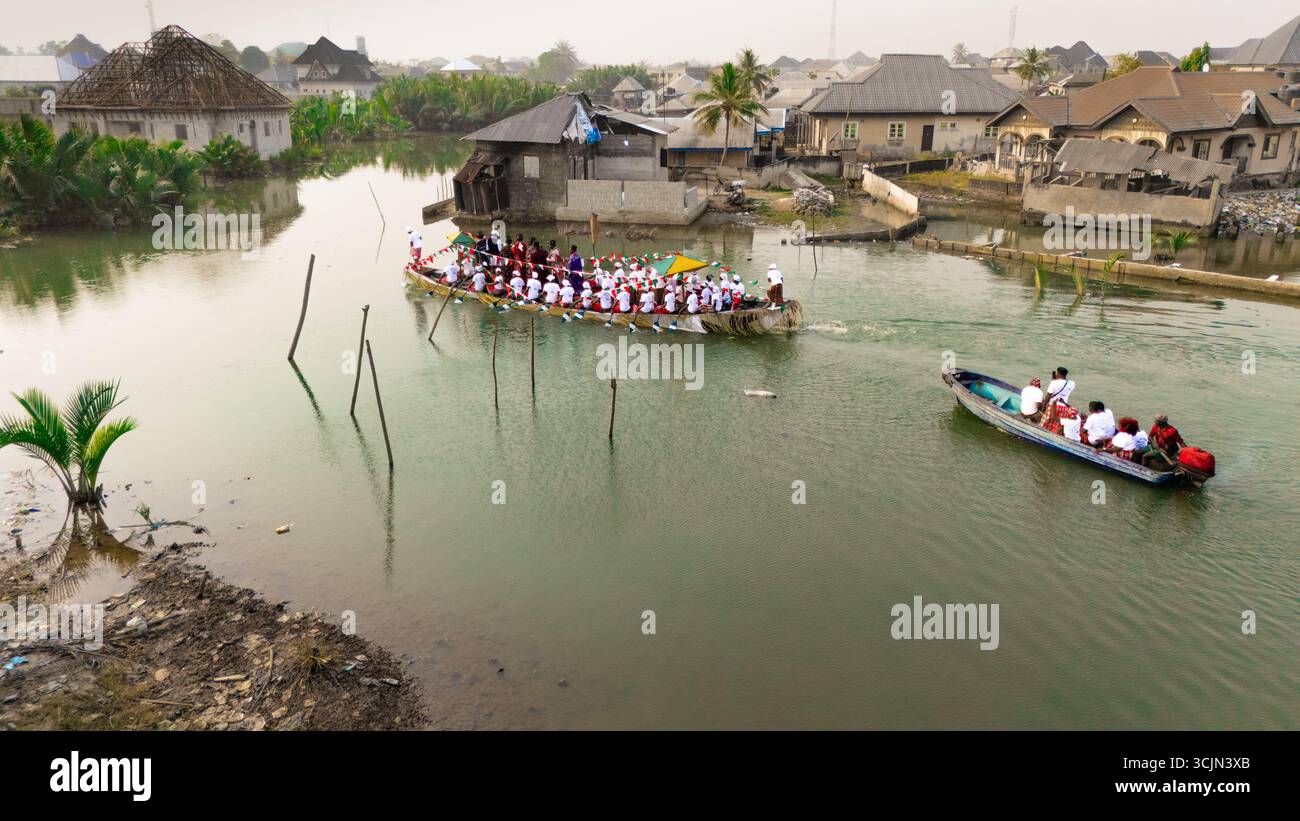 Aerial view of War Canoe of the Niger Delta carrying warriors navigate ...
