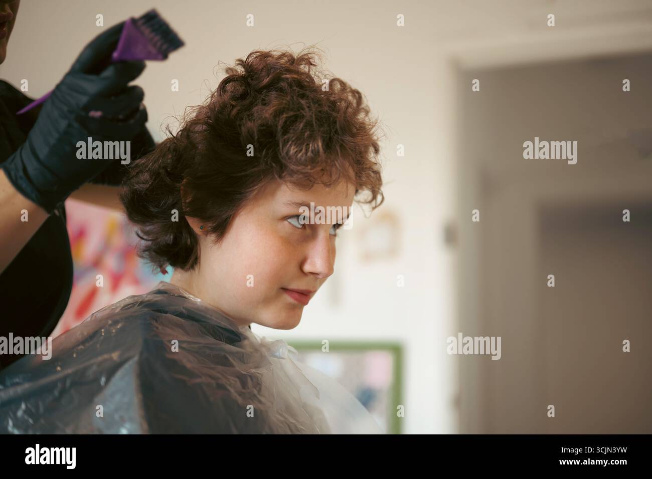Teen age girl at salon, dyeing her hair, changing hair color Stock ...
