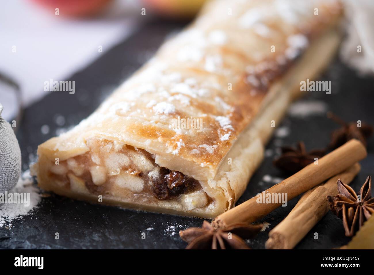Homemade apple strudel on white marble background. Traditional Austrian ...