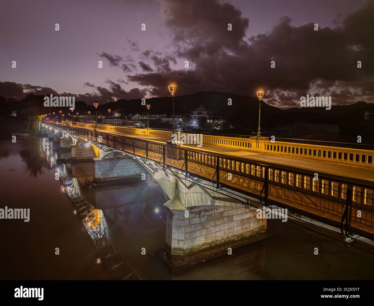 Aerial view of the Cavendish bridge illuminated by warm yellow lights ...