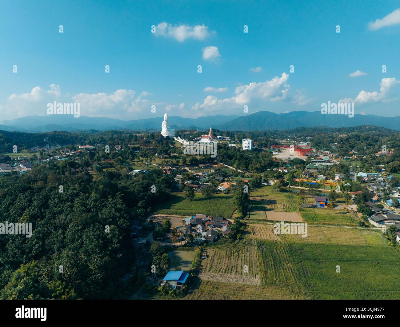 Aerial view of the serene Guan Yin statue standing majestically amidst ...