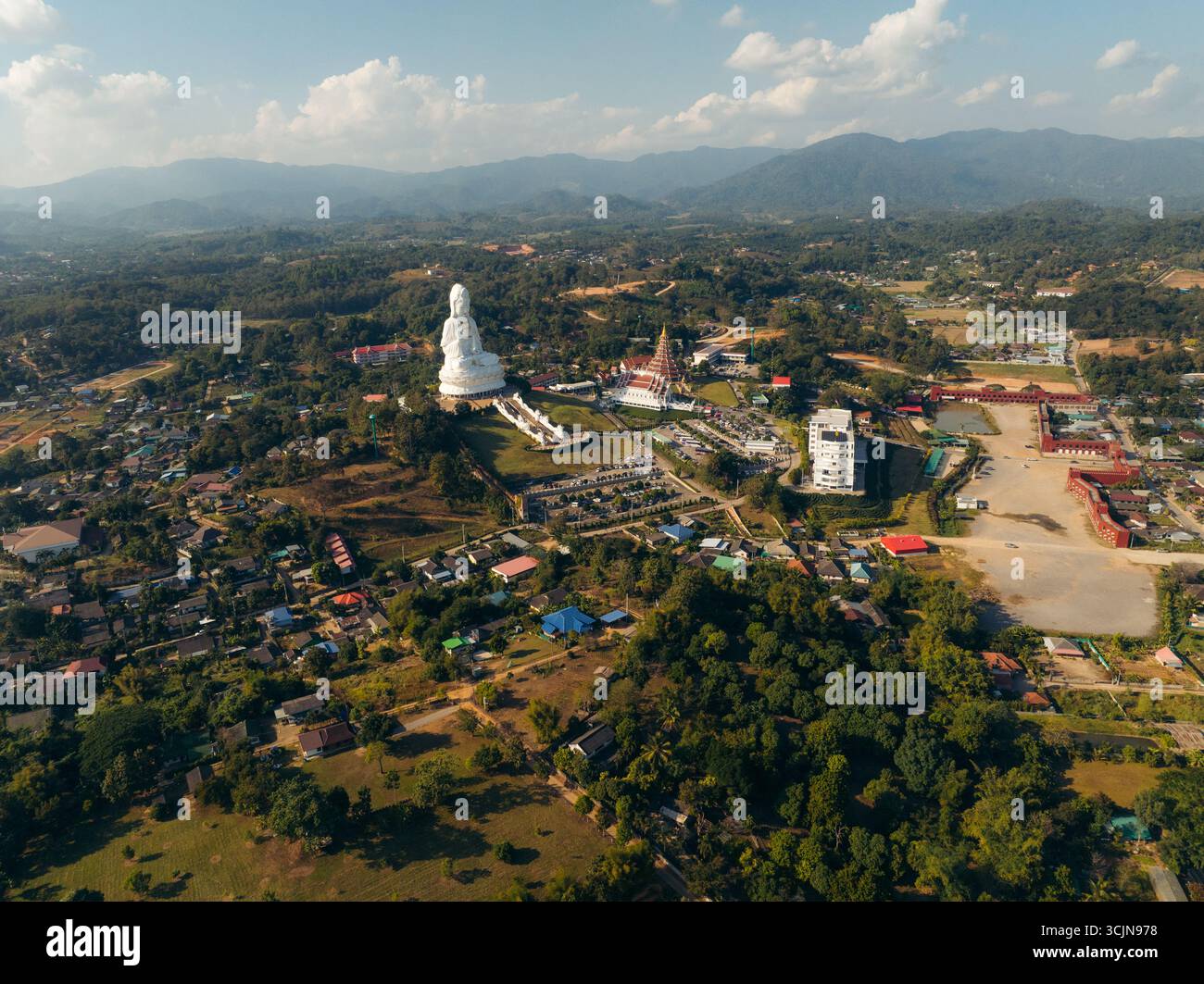 Aerial view of the serene Guan Yin statue standing tall amidst the ...