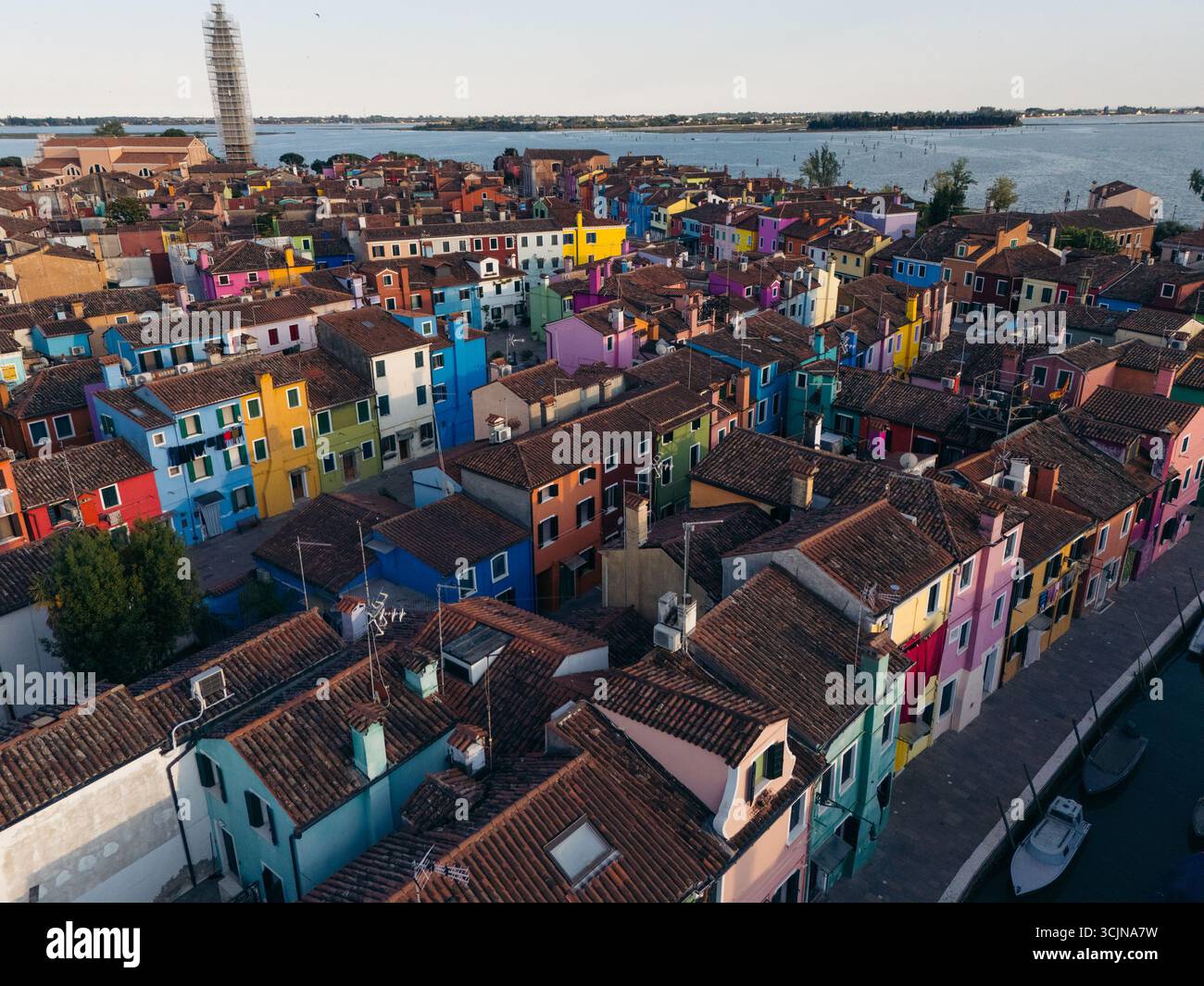 Aerial view of vibrant houses with multi-colored facades and terracotta ...
