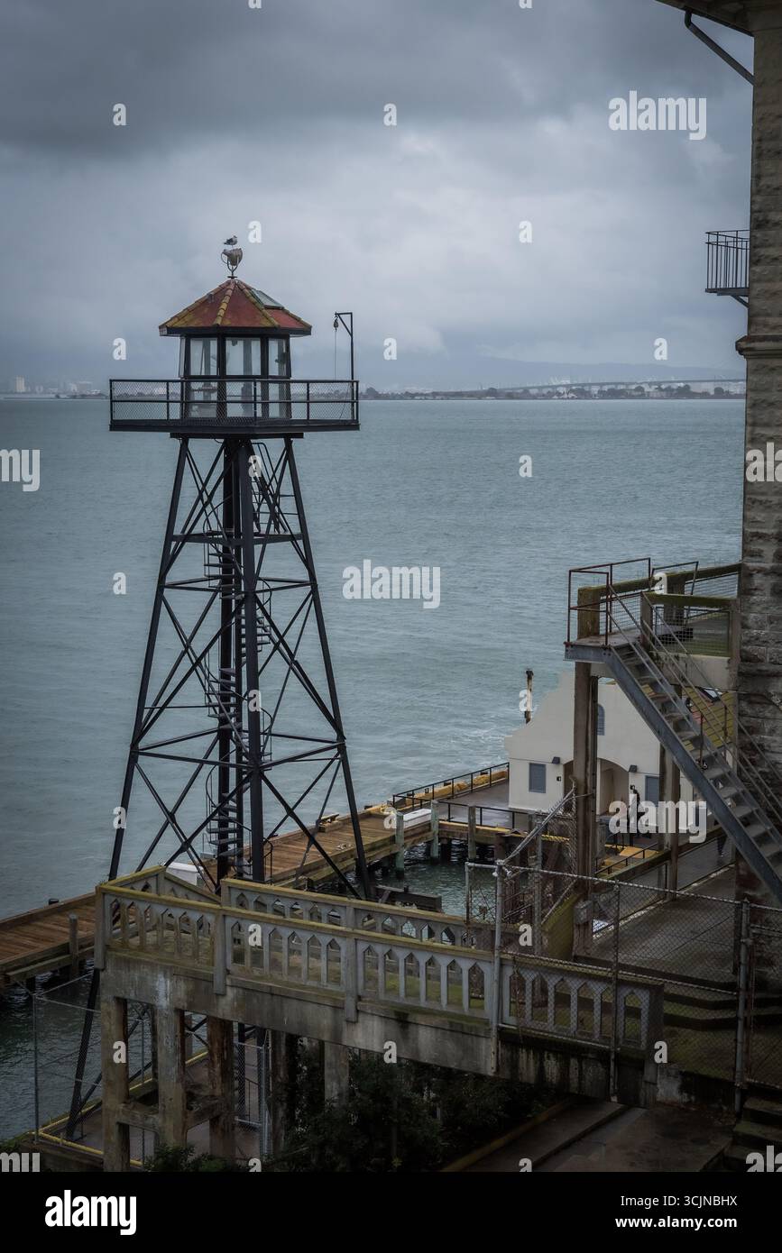 View of a weathered watchtower standing tall against the muted greys of ...