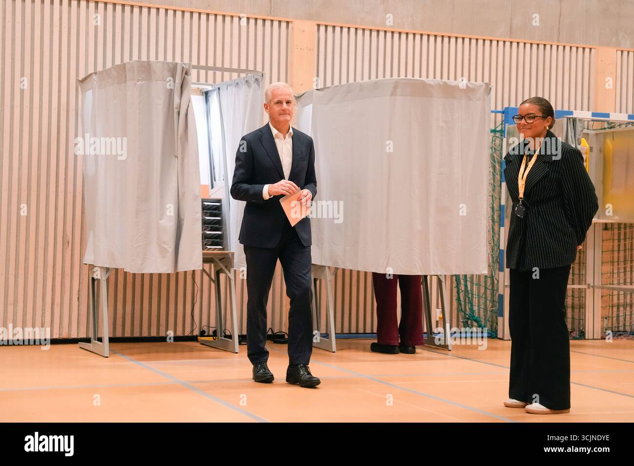 Labor Party leader Jonas Gahr Store leaves a polling booth during ...