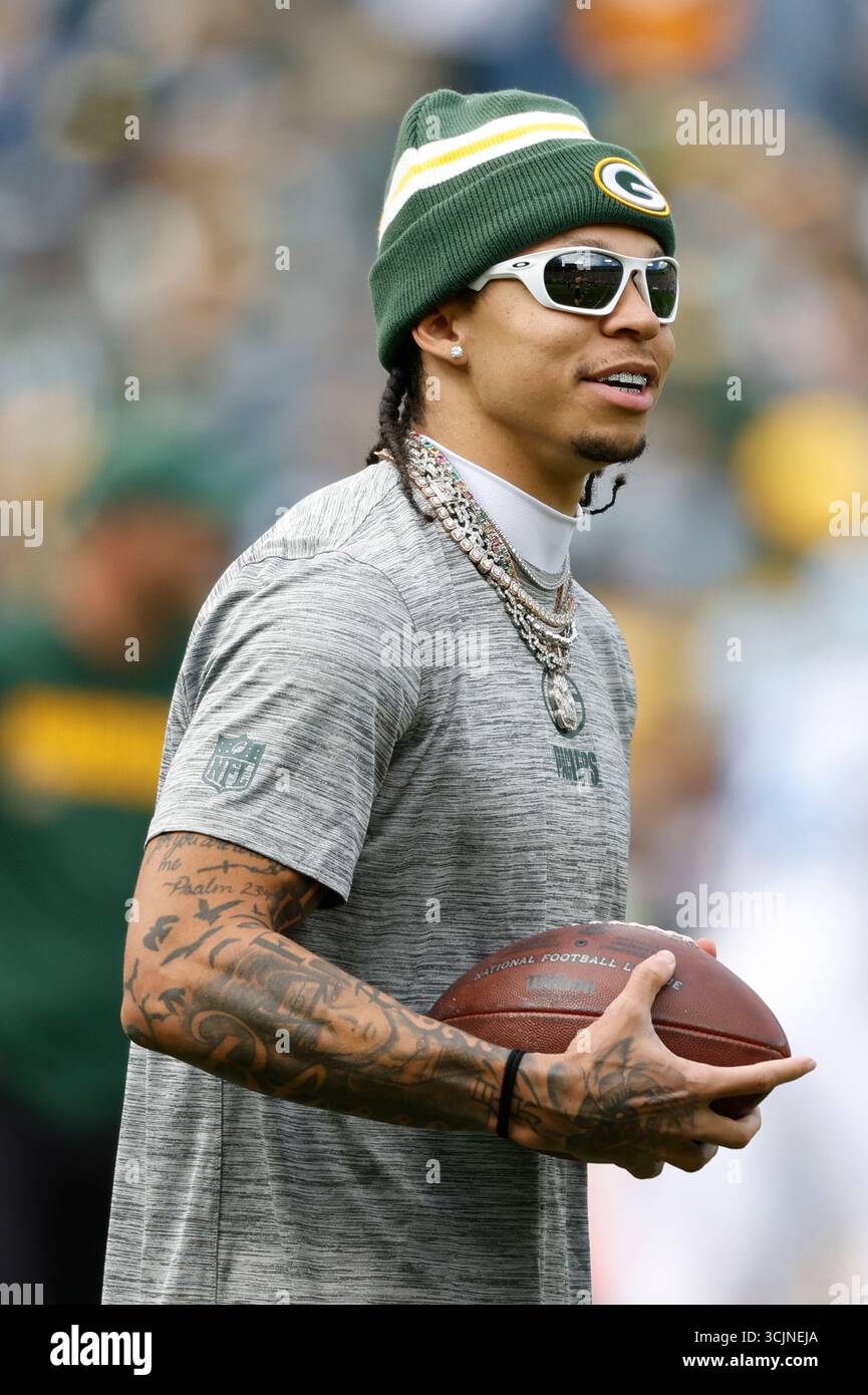 Green Bay Packers' Christian Watson on the field before a NFL football ...