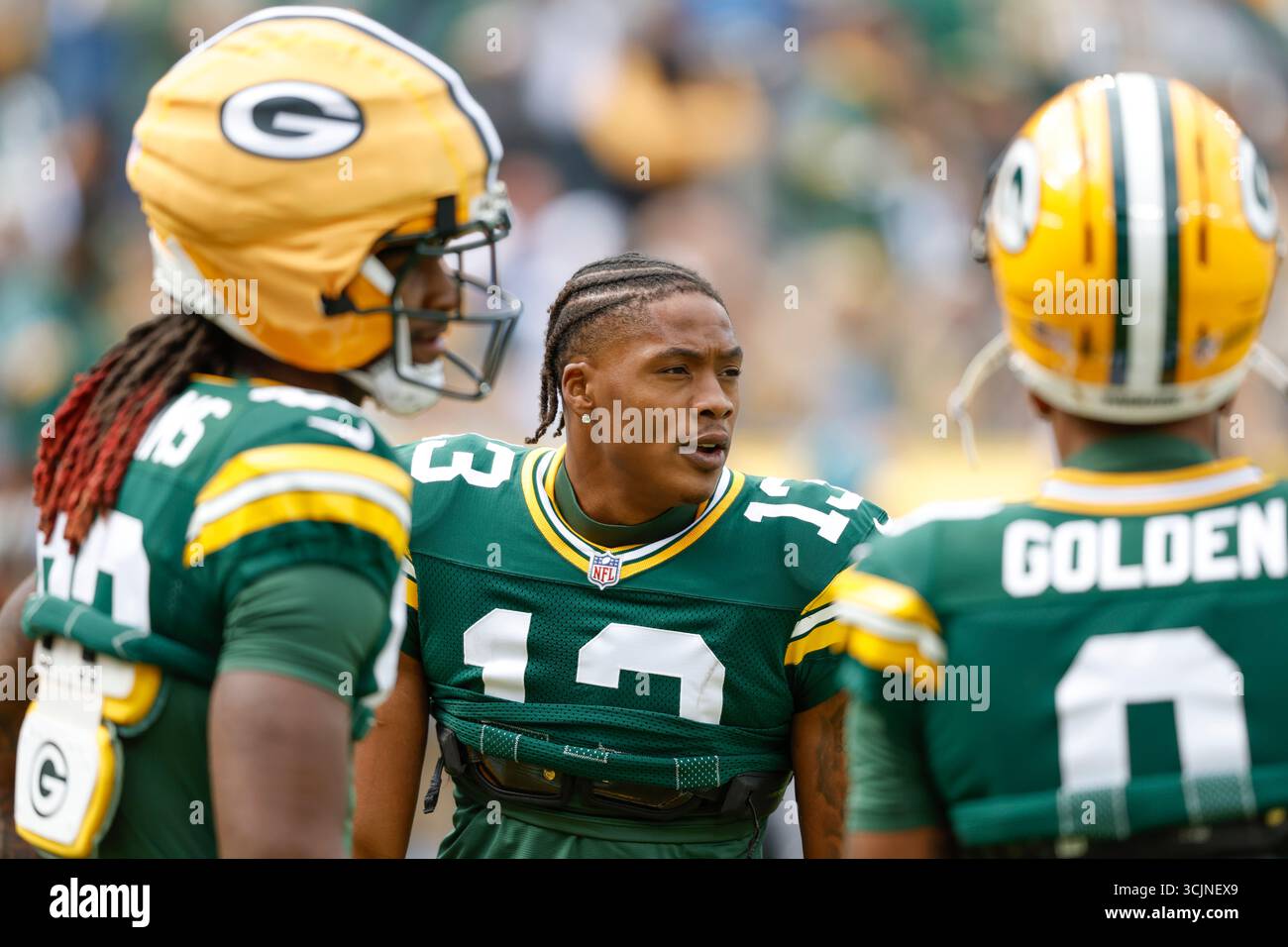 Green Bay Packers wide receiver Dontayvion Wicks (13) on the field ...